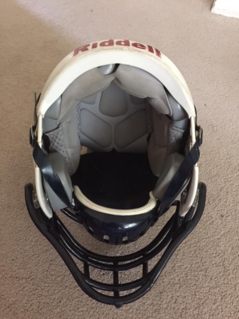 White riddell revolution speed helmet with blue lineman facemask ...