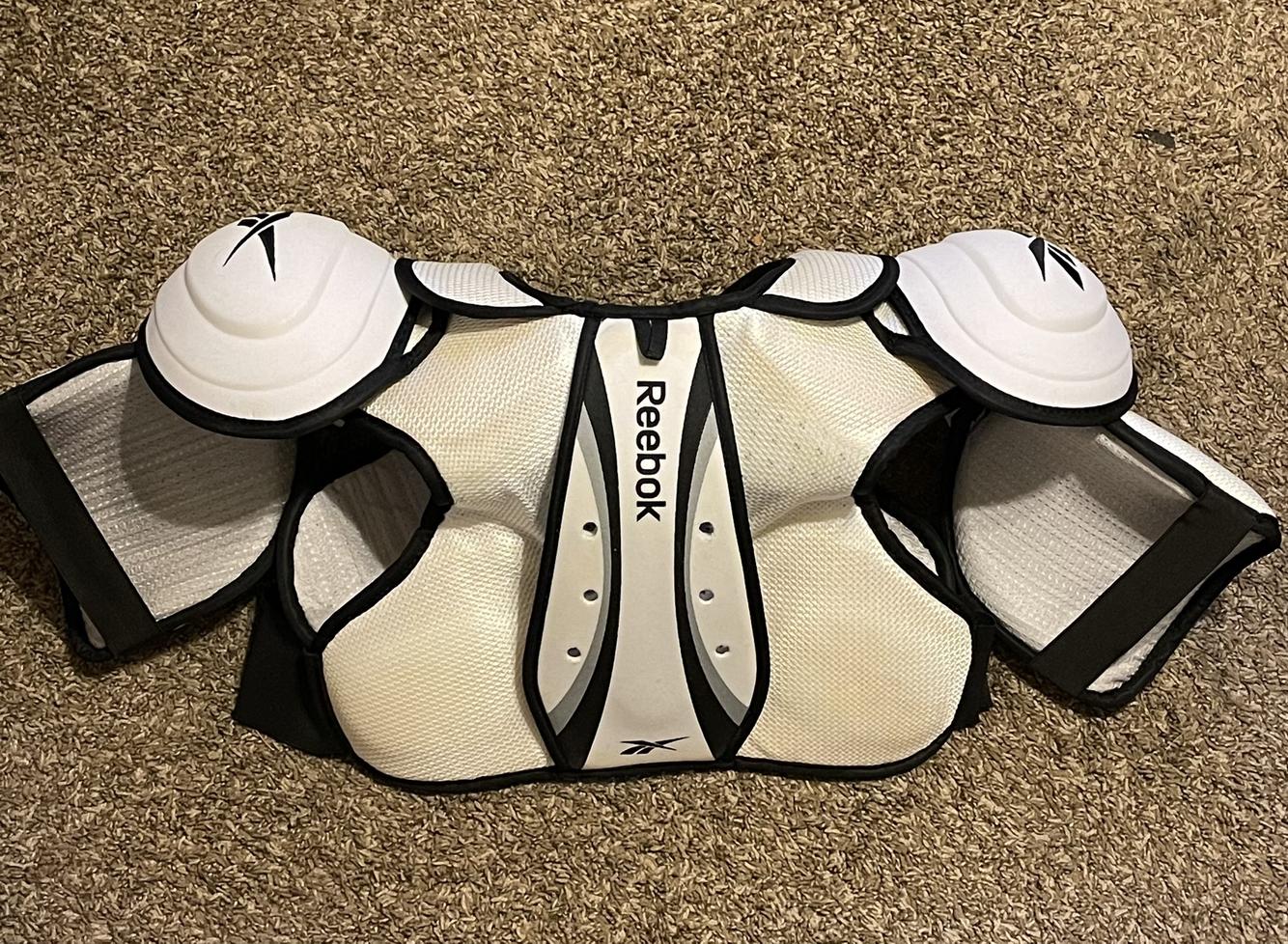 Pro stock Reebok 7k shoulder pads | SidelineSwap