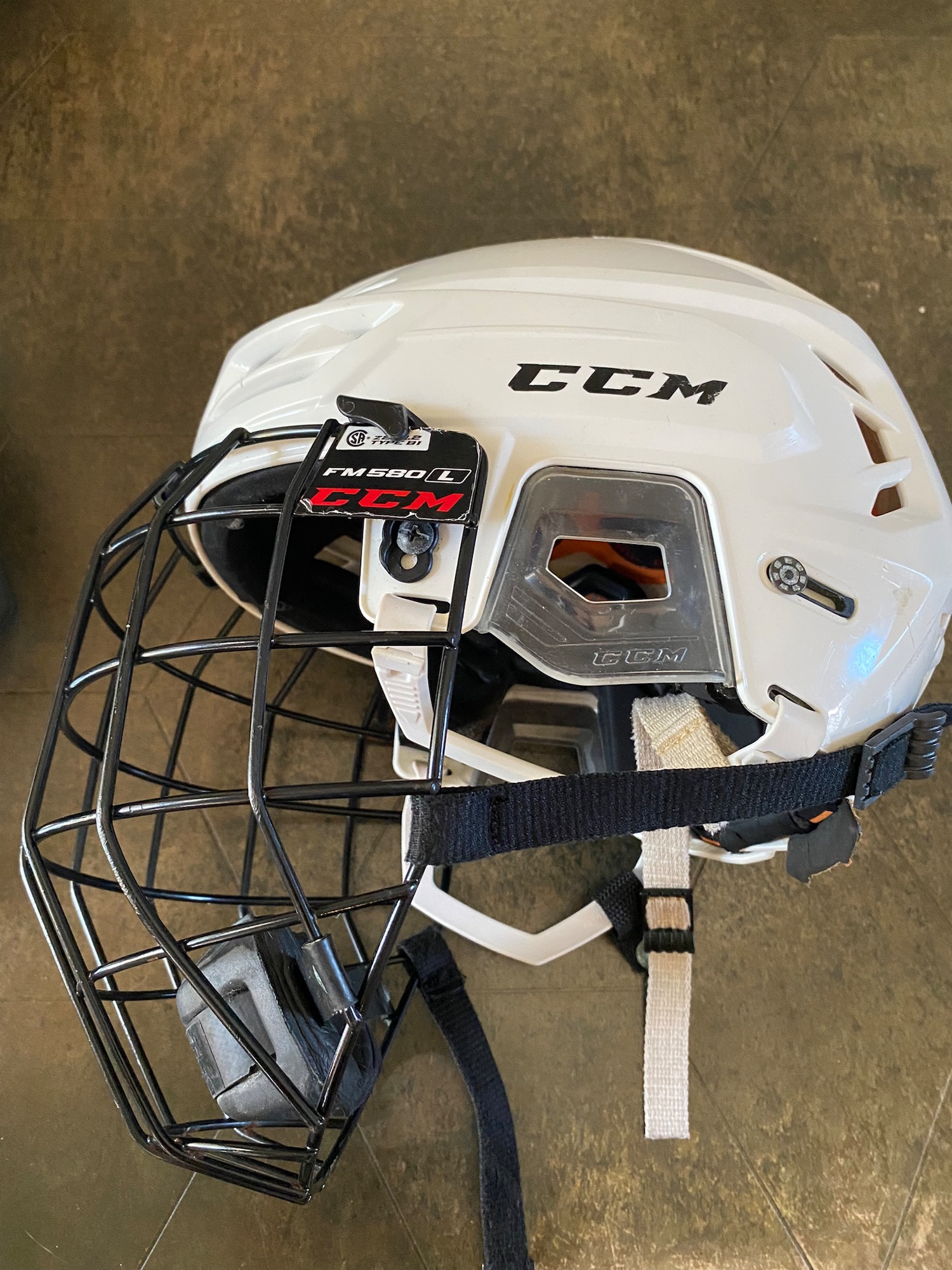 Used Large CCM Tacks 710 Helmet with Black FM580 Cage | SidelineSwap