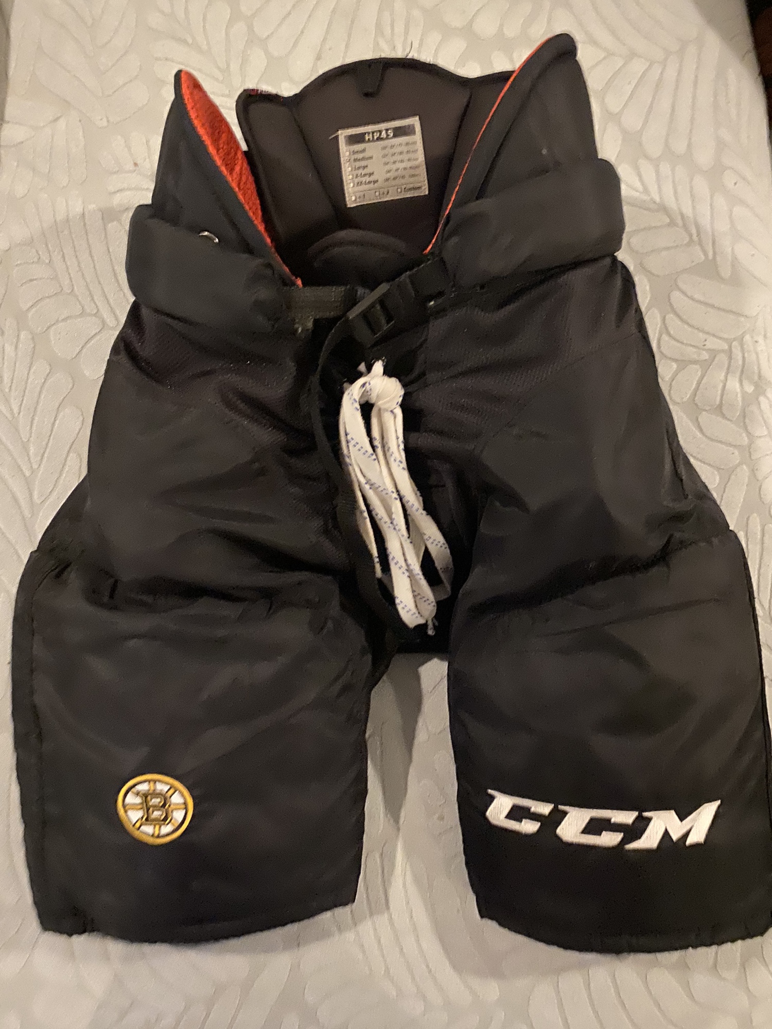 CCM HP45 Pro Stock Boston Bruins Hockey Pants Sz. Med | SidelineSwap