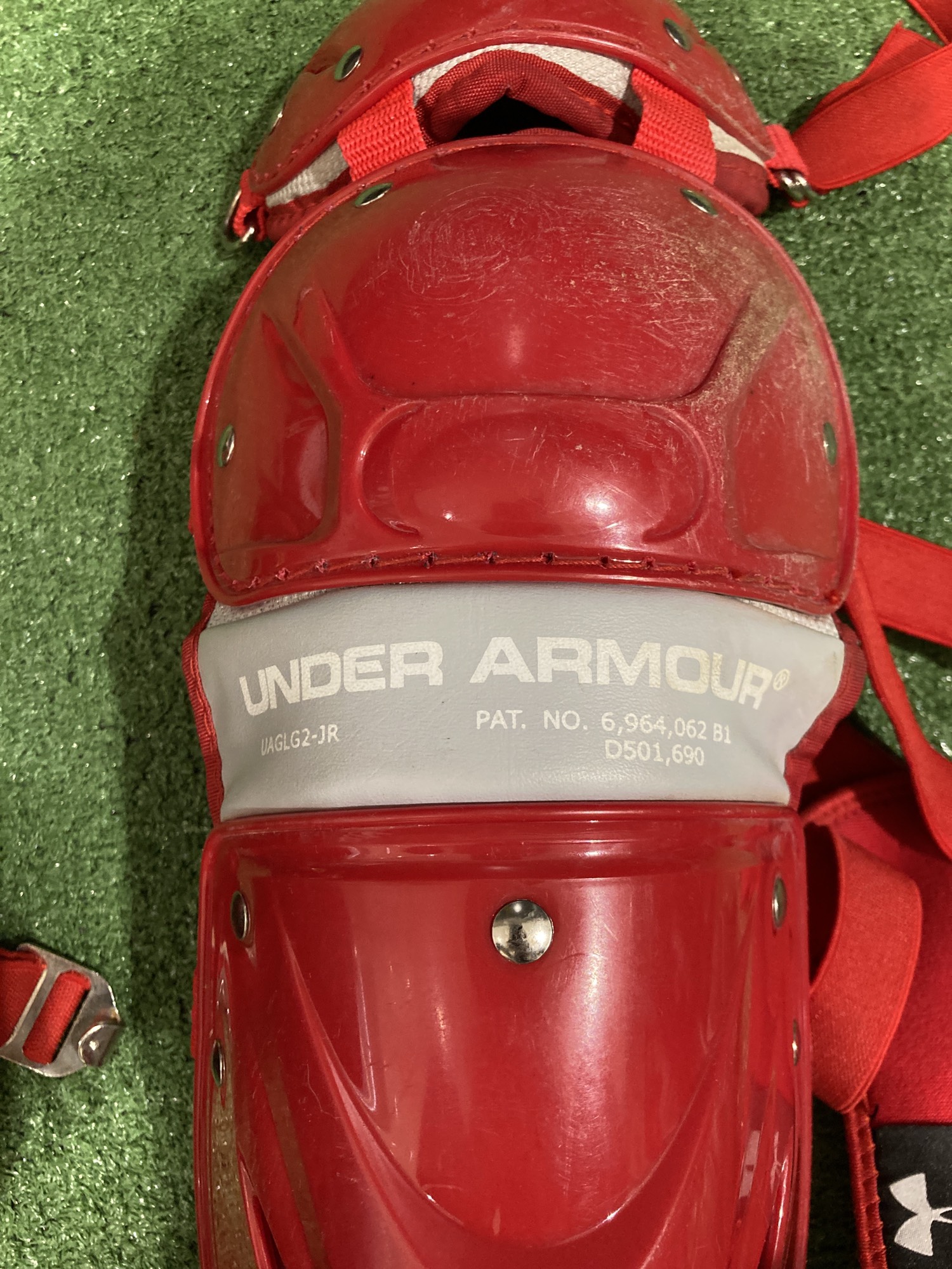 Red Used Intermediate Under Armour Catcher's Leg Guards | SidelineSwap